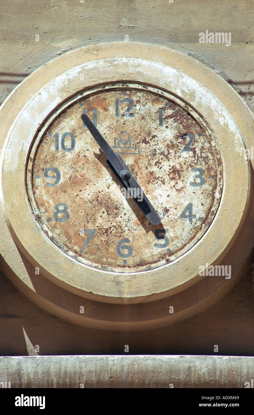 4 55pm on old dilapidated rusty outdoor clock Stock Photo - Alamy
