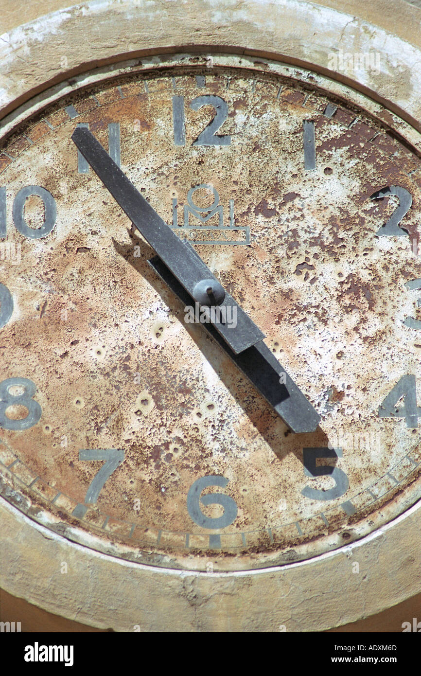 4 55pm on old dilapidated rusty outdoor clock Stock Photo - Alamy