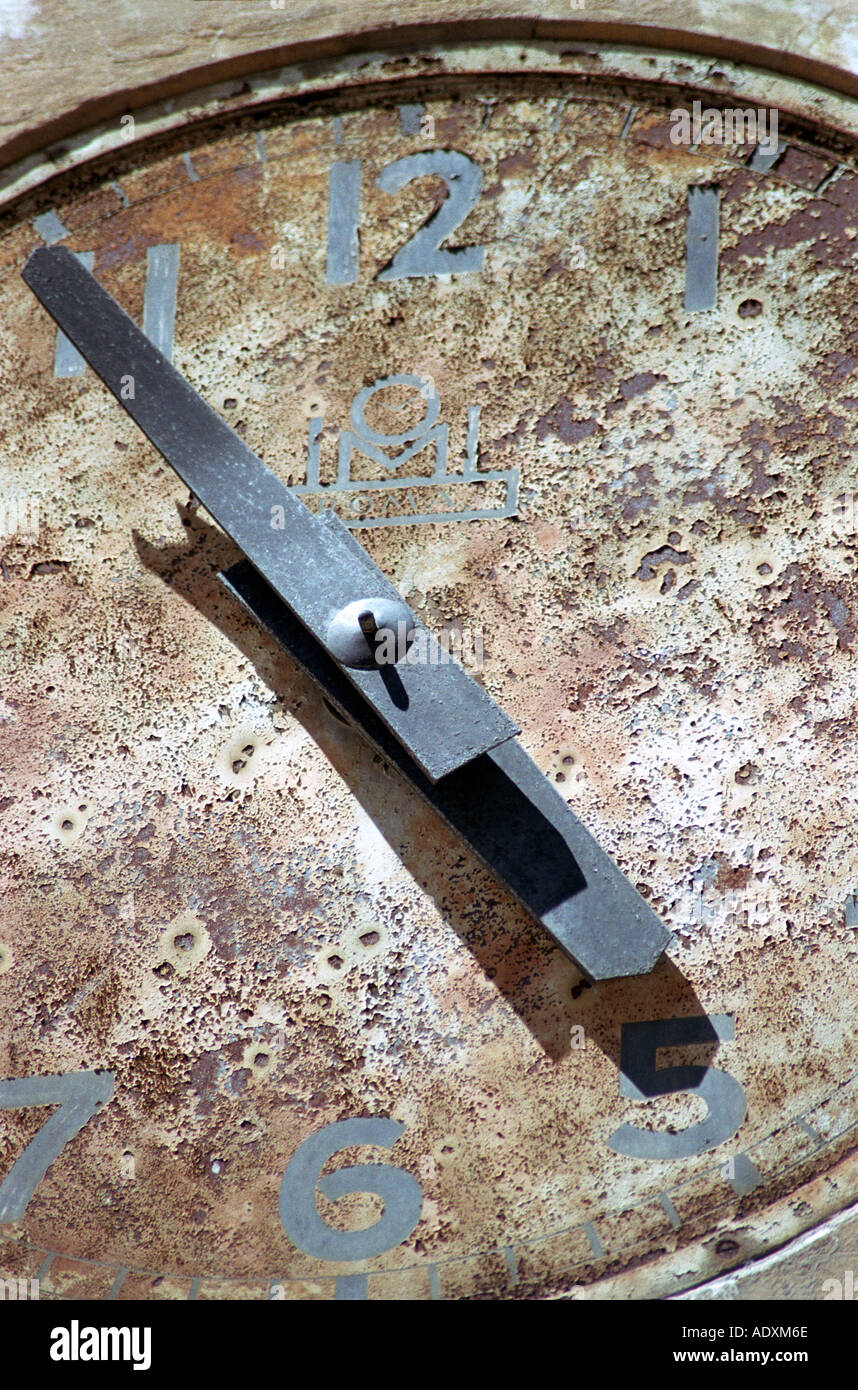 4 55pm on old dilapidated rusty outdoor clock Stock Photo - Alamy