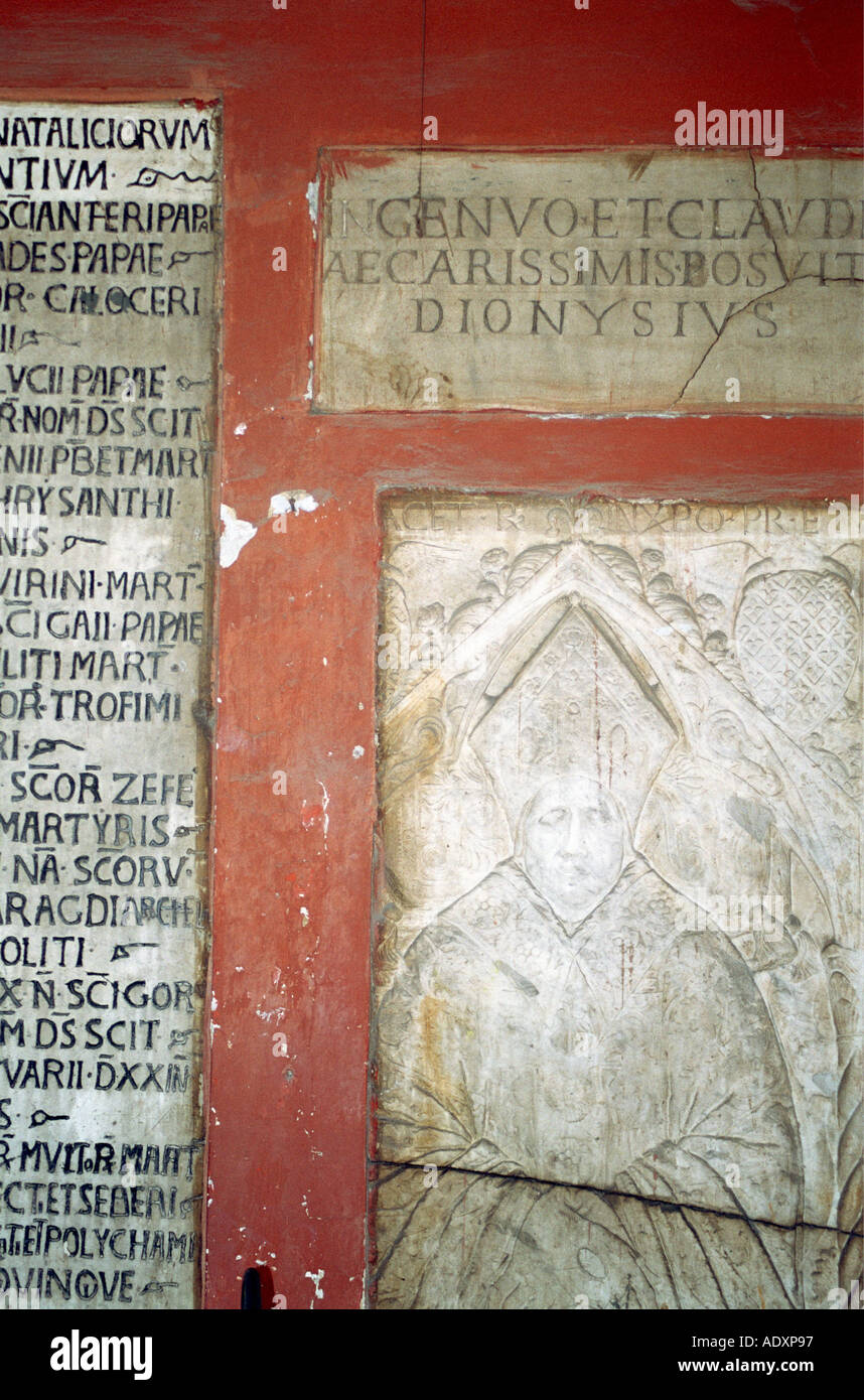 priest and ancient writing carvings at San Silvestro in capite rome ...
