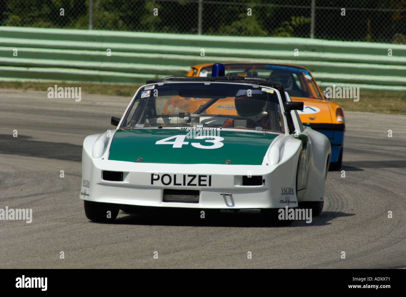 Timothy Green races his 1971 Porsche 914 6 followed by Michael Eisele ...