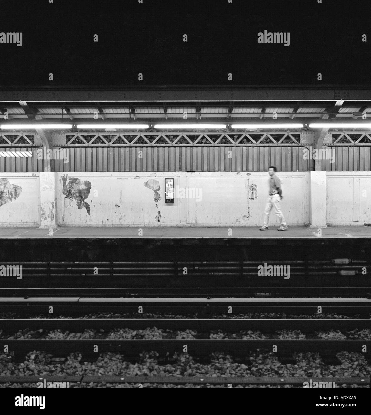 Man waiting for subway train, Brooklyn, New York Stock Photo - Alamy