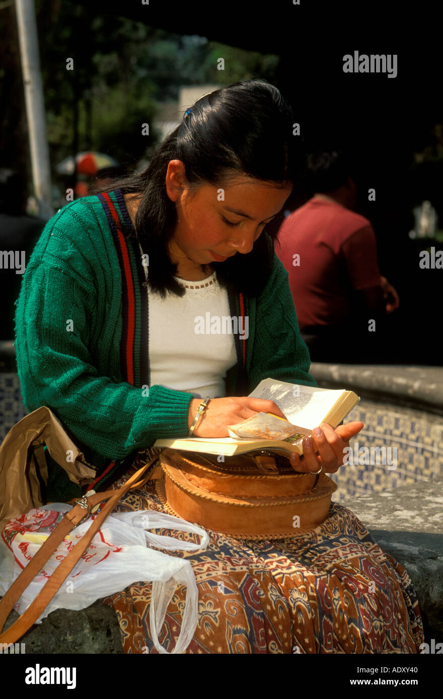 1, one, Mexican woman, adult woman, reading book, San Jacinto Plaza ...