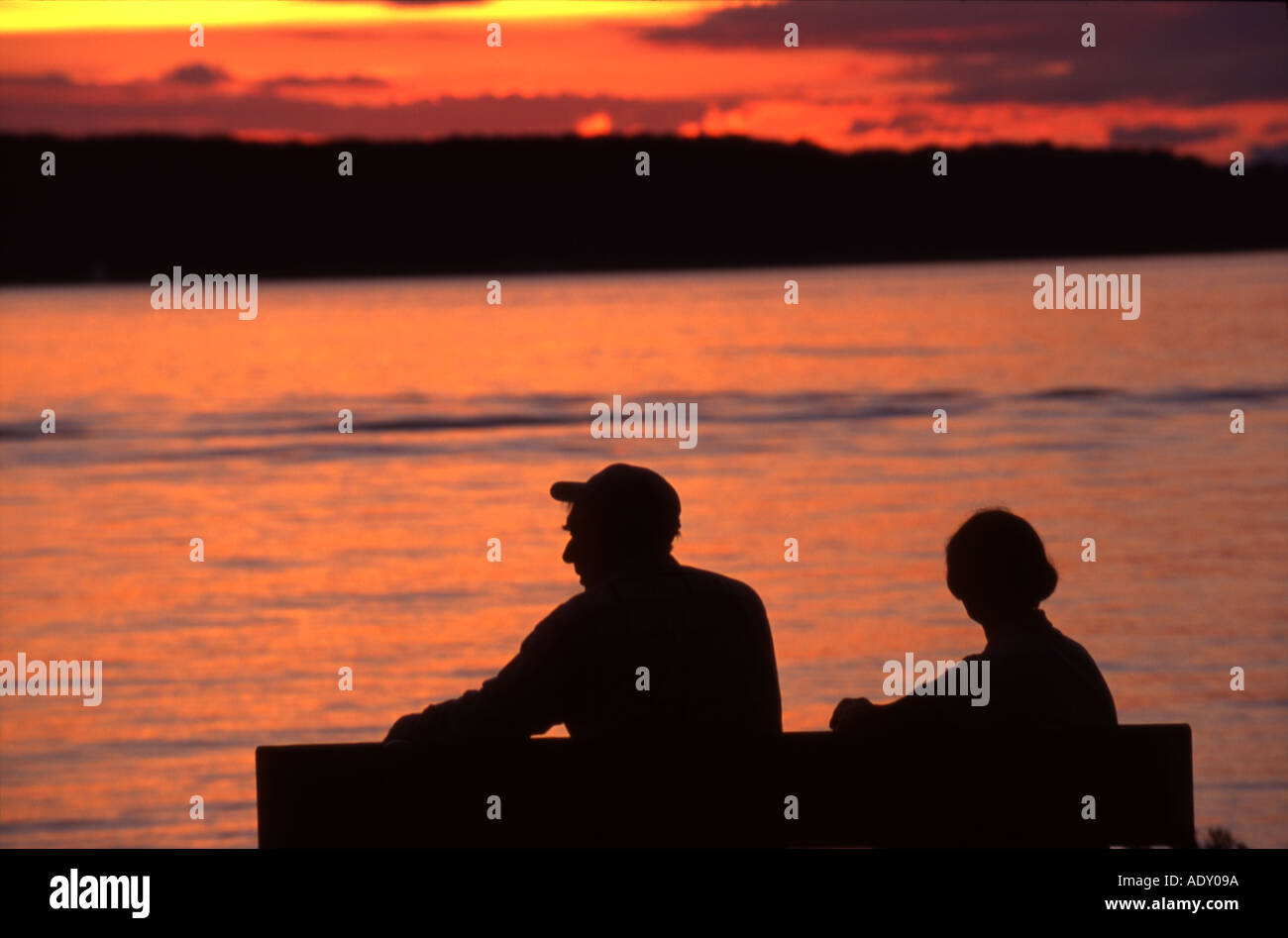 Older woman watching sunset hi-res stock photography and images - Alamy