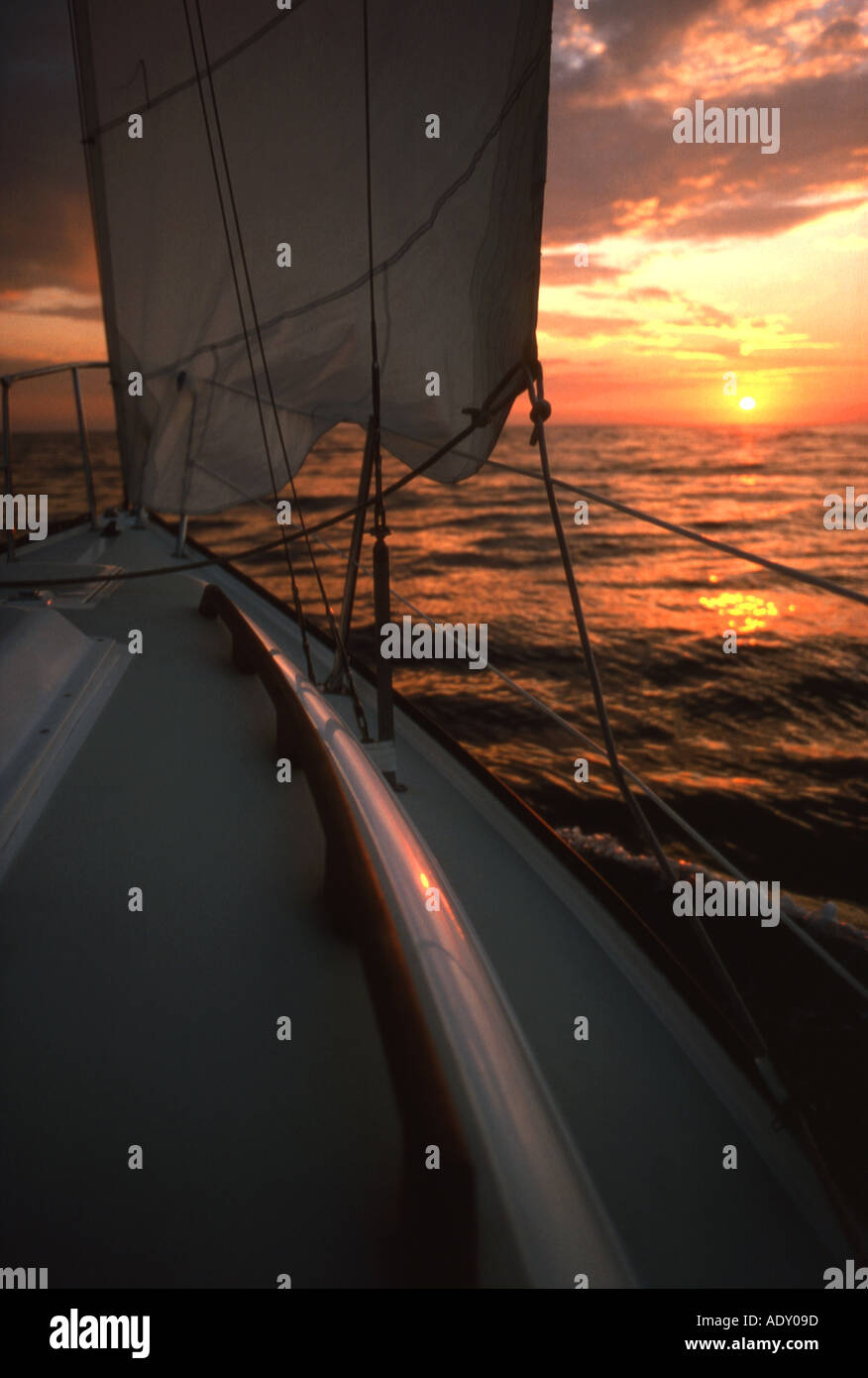 Ocean Sailing into Sunset Stock Photo - Alamy