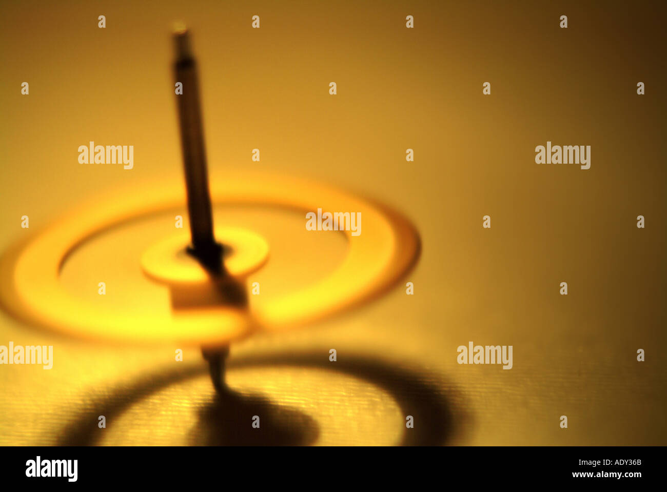 Business Concepts I yellow gold golden whipping top spin spinning ...