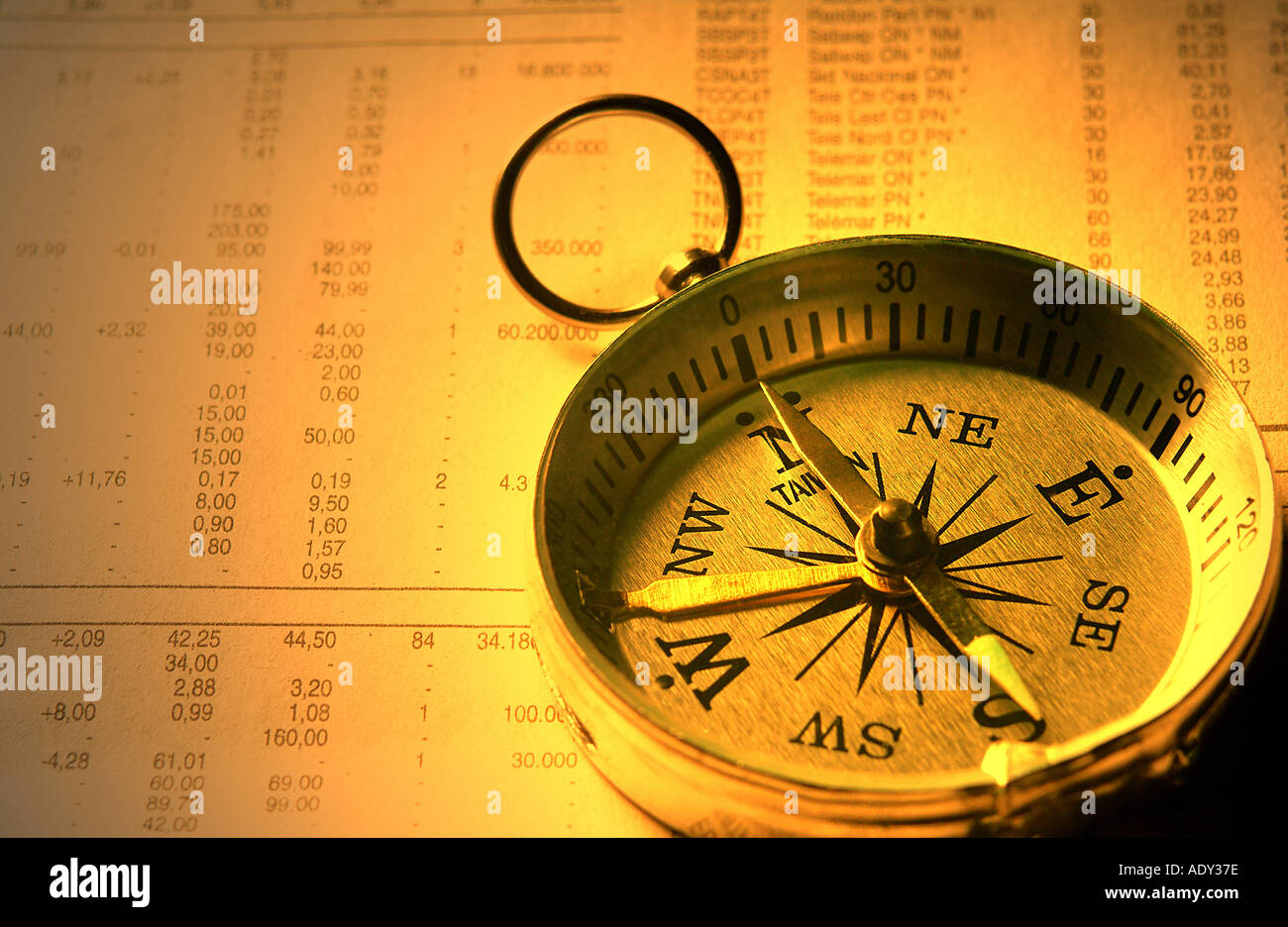 Business Concepts I compass north magnetic newspaper financial section ...