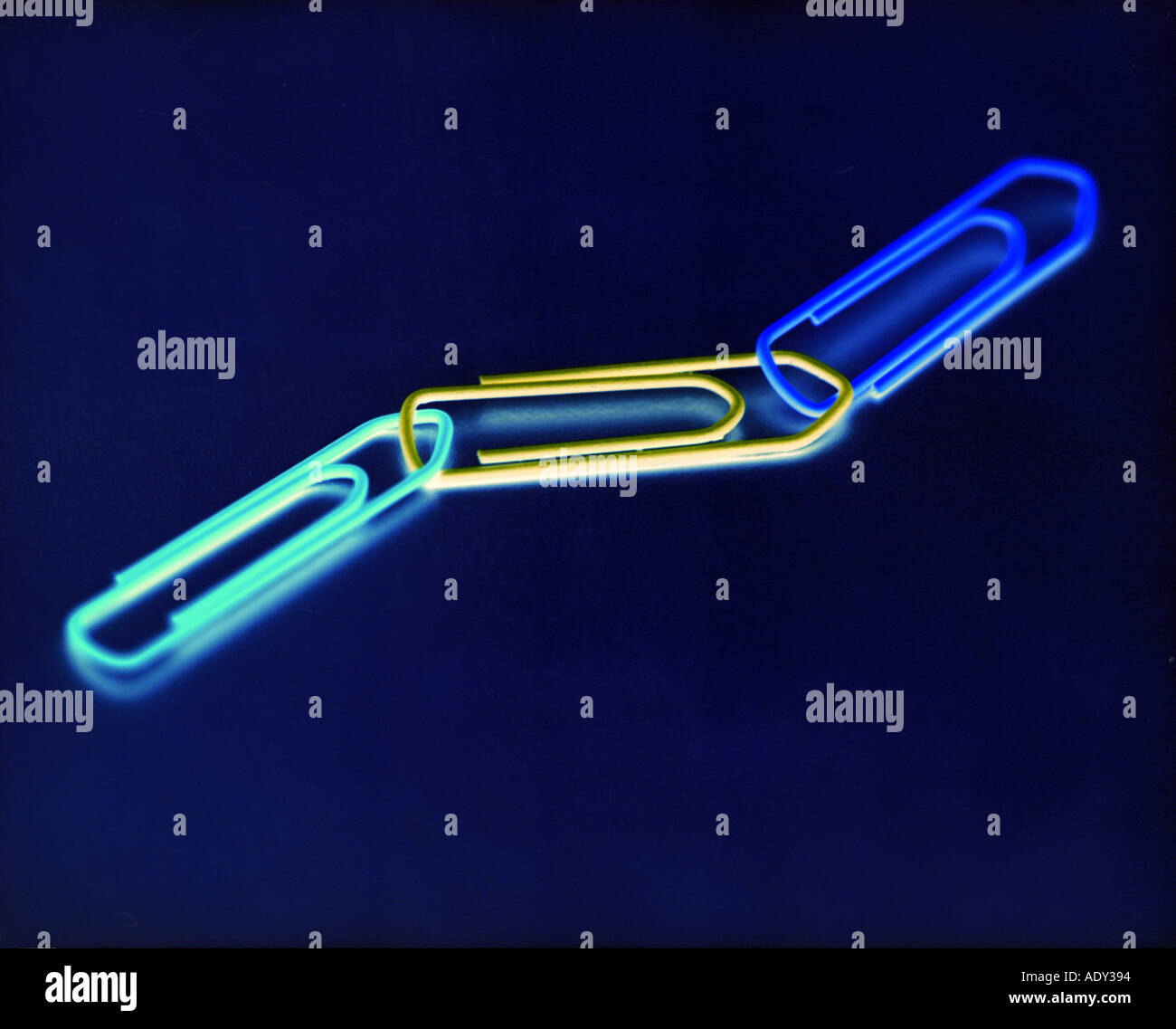 Business Concepts I paper clips three trio connected entwined green ...