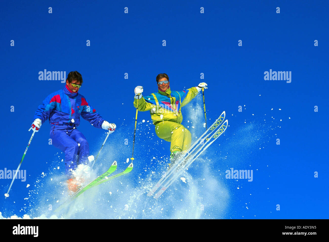 two skiers jumping, side by side Stock Photo - Alamy