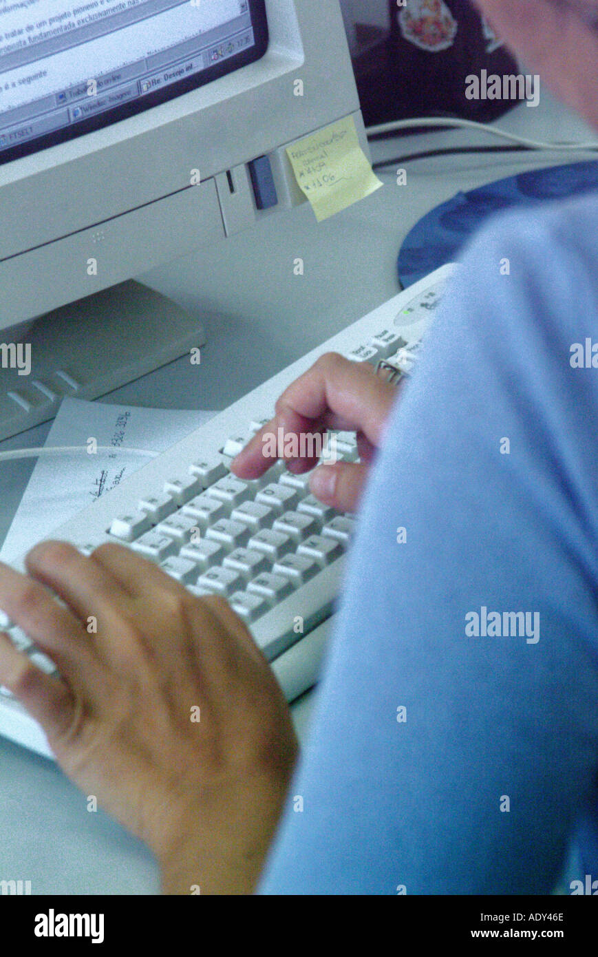 Computer Comm indoors day daylight office work monitor keyboard typing ...