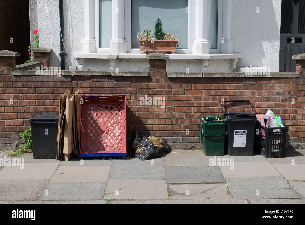 Rubbish bins on the pavement awaiting collection Stock Photo - Alamy