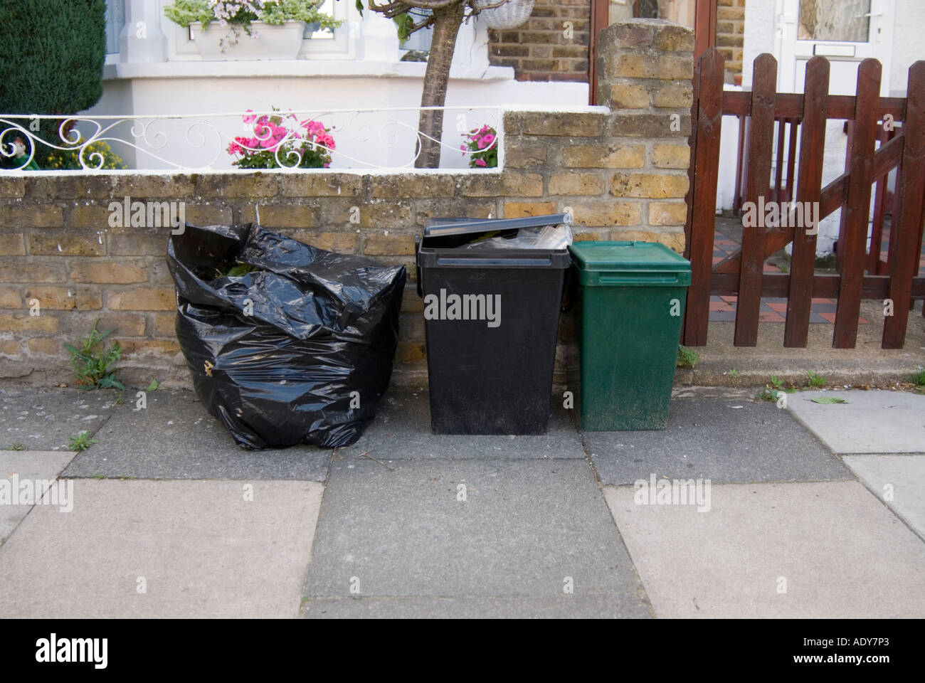 Rubbish bins on the pavement awaiting collection Stock Photo - Alamy