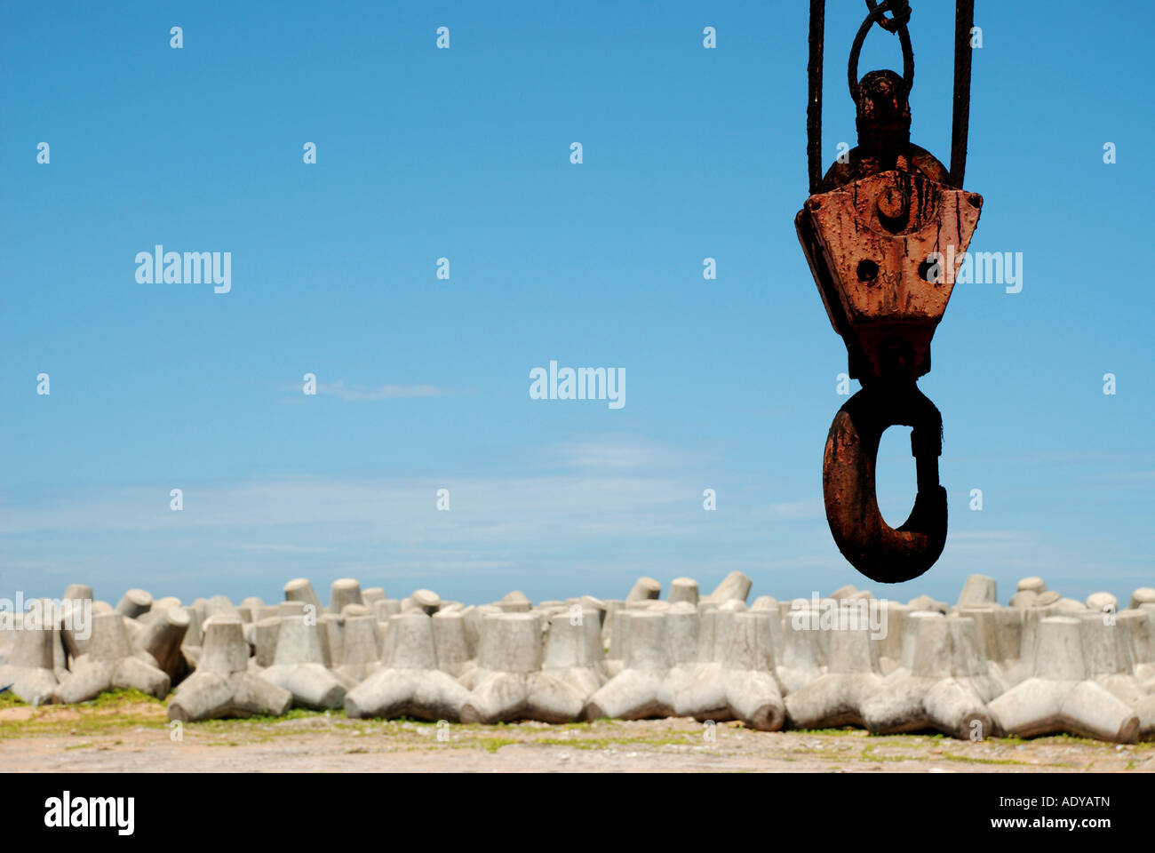 hanging crain huck ageganest concrete storn and blue sky Stock Photo ...