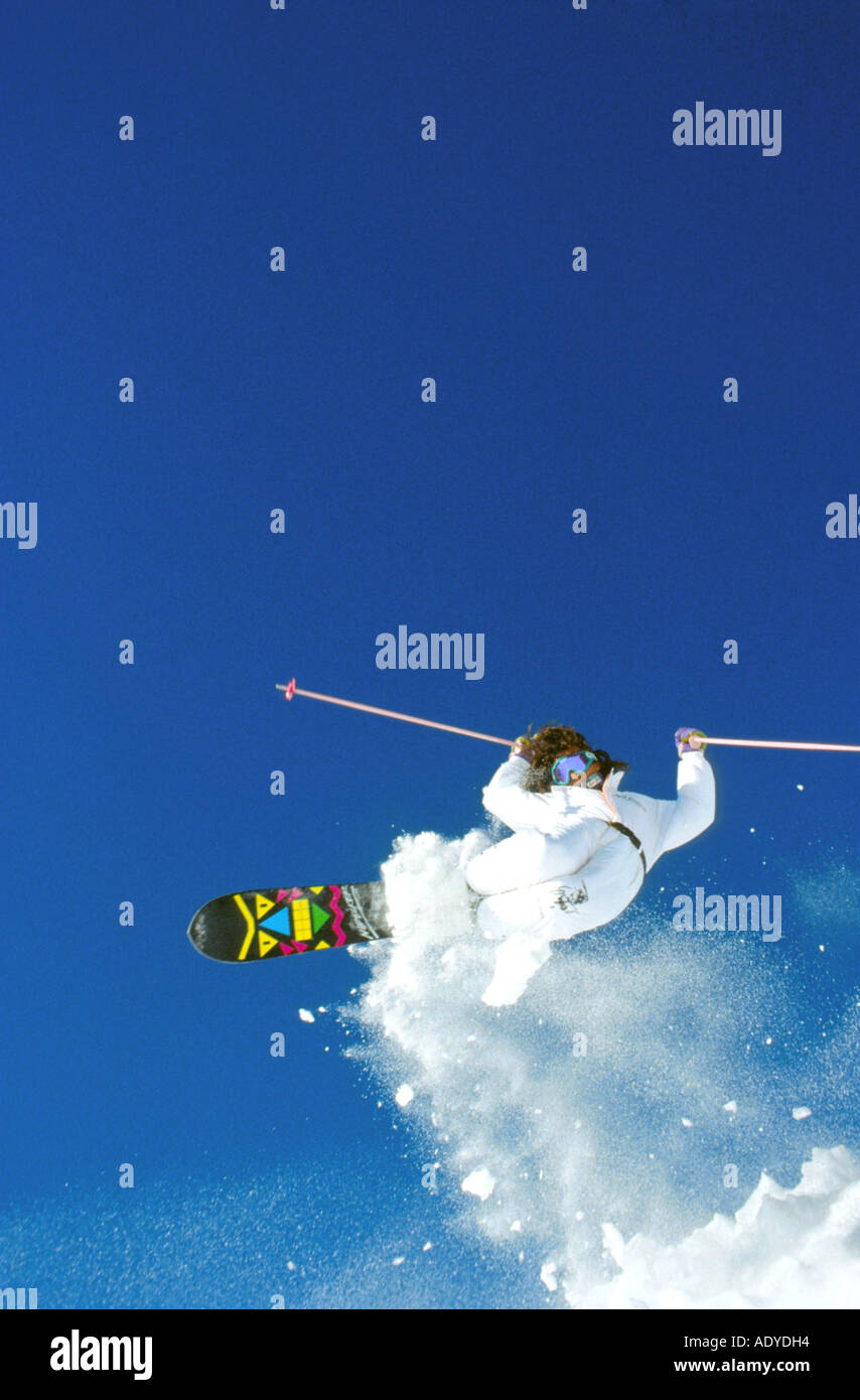 female skier in midair jump, doing trick, with monoski Stock Photo - Alamy