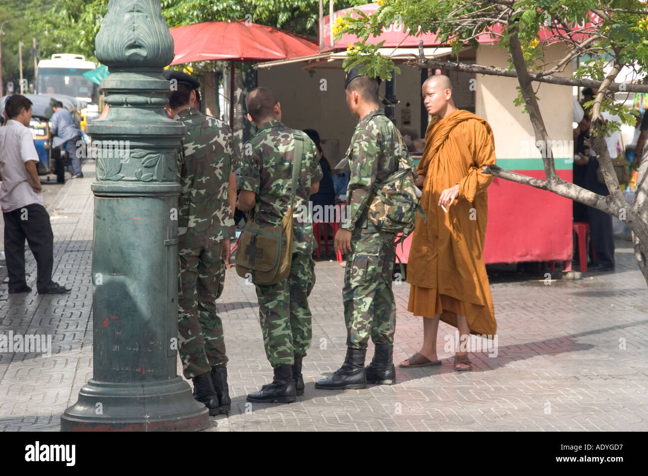 Men in uniform a Buddhist monk with soldiers outside Wat Po in Bangkok ...