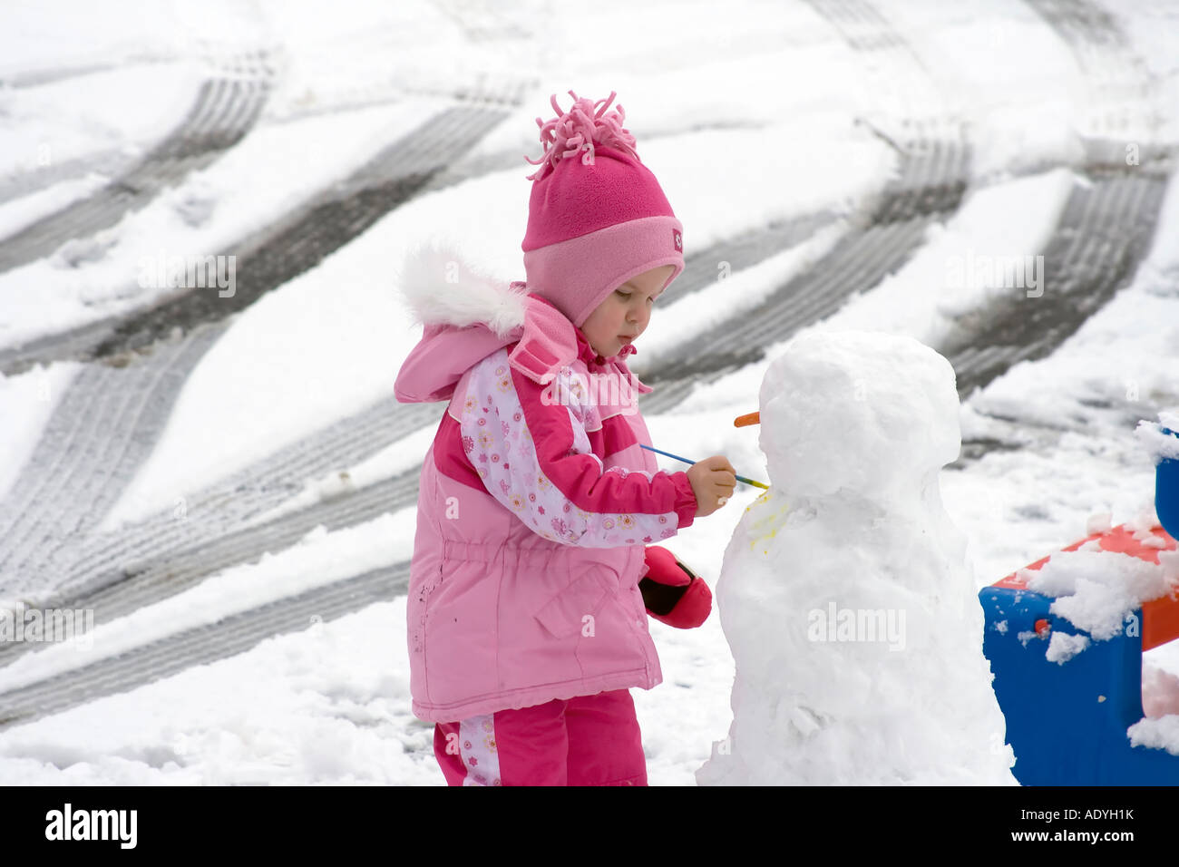 girl coloring snowman Stock Photo - Alamy