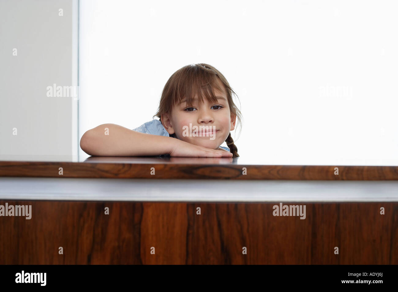 Girl resting head on table hi-res stock photography and images - Alamy