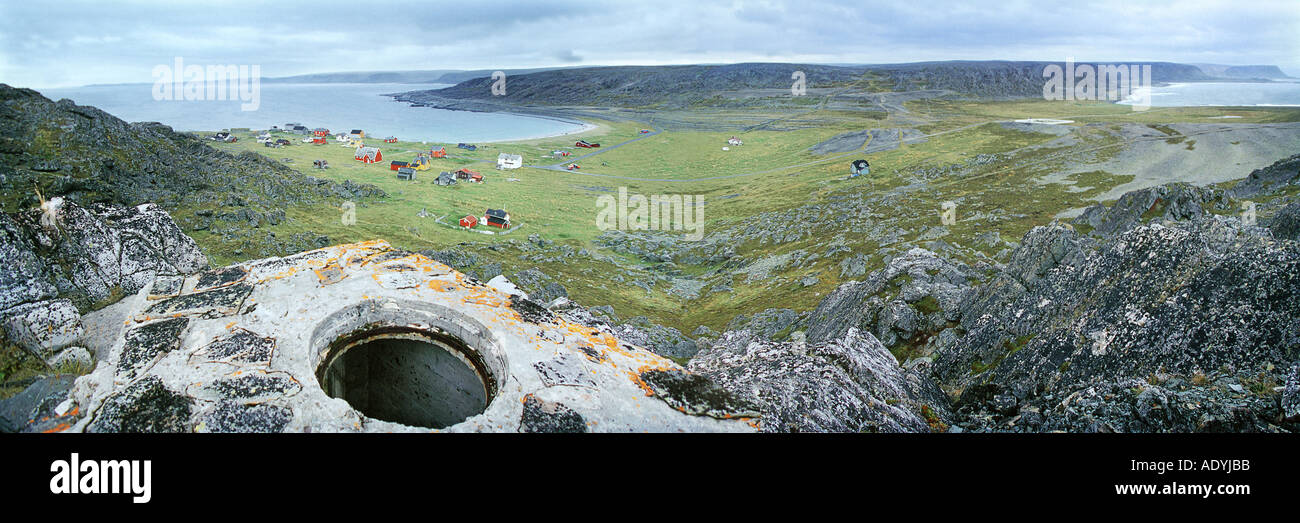 view from mountain over a arctic village, entrance to bunker in the ...