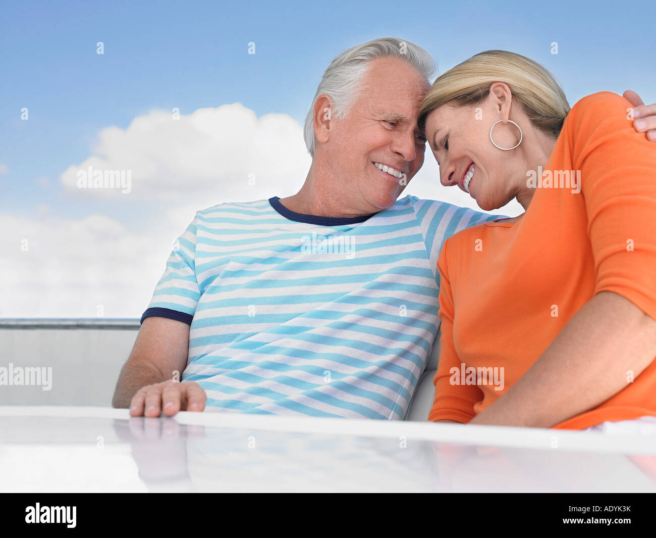 Middle-aged couple outdoors, embracing and smiling Stock Photo - Alamy