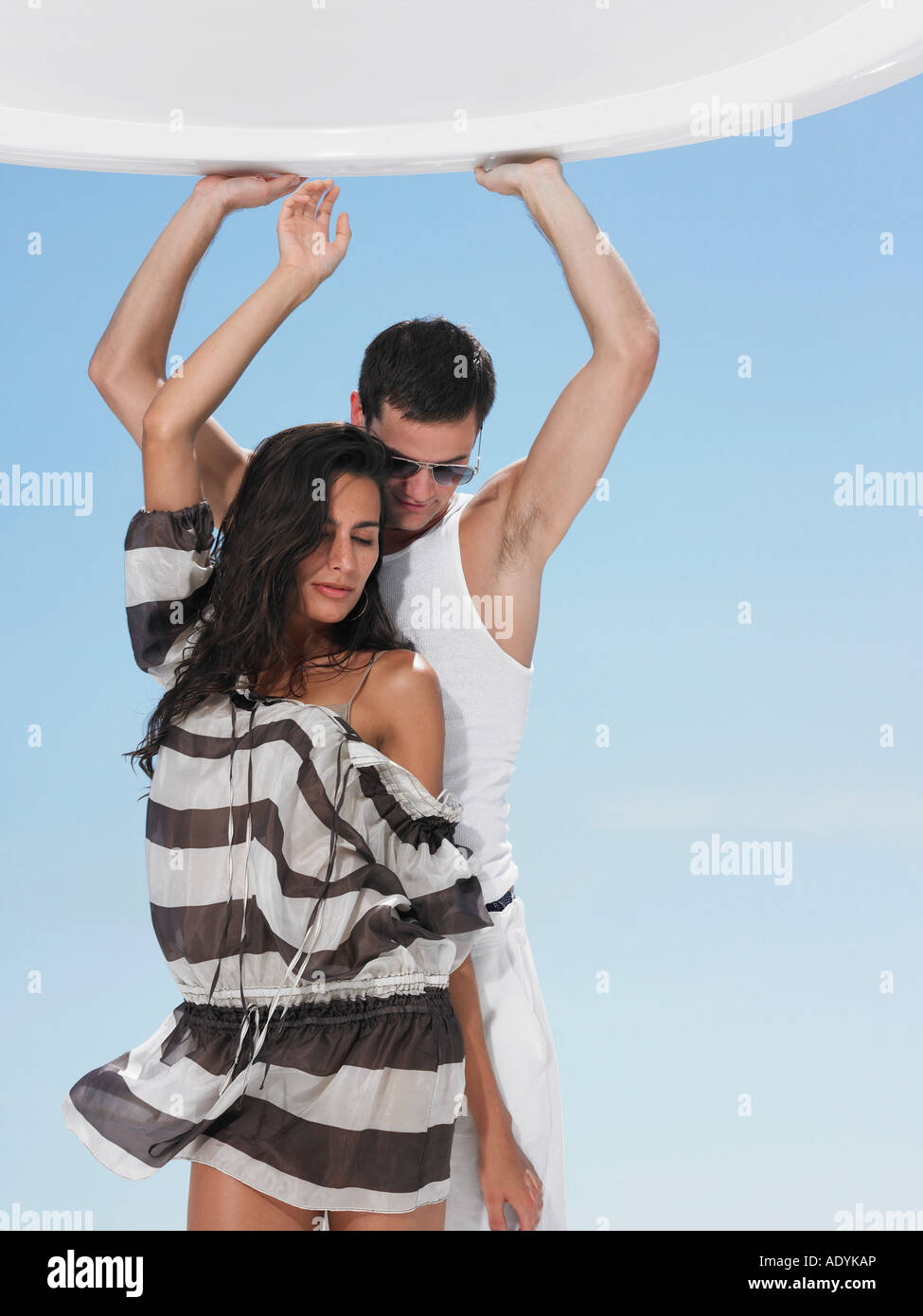Young couple dancing against sky Stock Photo - Alamy