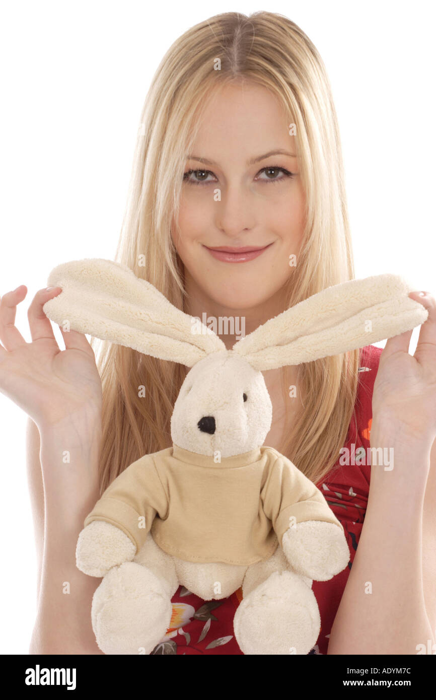 long-haired blonde woman with toy rabbit Stock Photo - Alamy