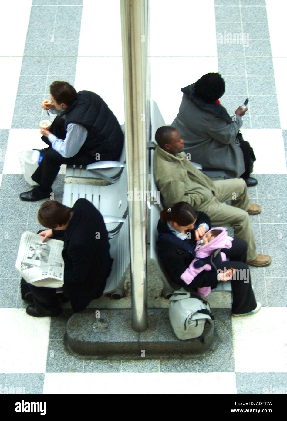 people waiting at Railway station Stock Photo - Alamy