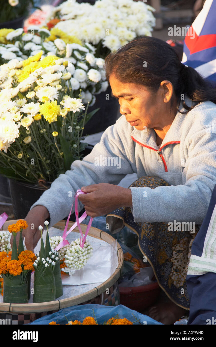 Woman Selling Flowers At Market Stock Photo - Alamy