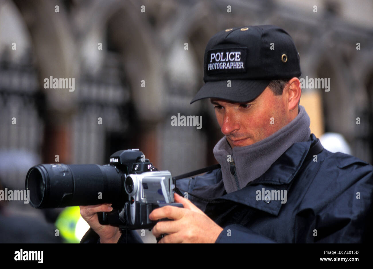 Police photographer at work during a demonstration in central London ...