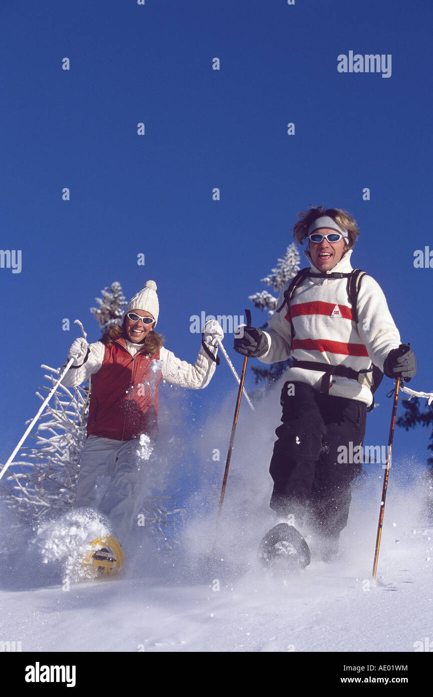 Man woman hiking snowshoes hi-res stock photography and images - Alamy