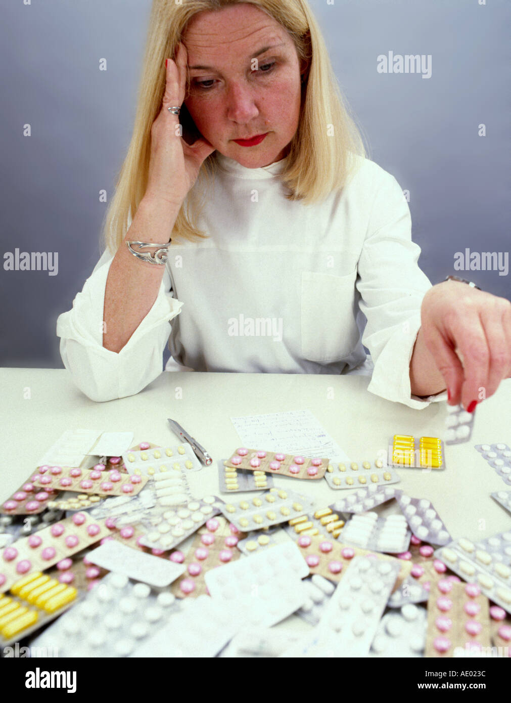 Doctor has problems with the variety of pills Stock Photo - Alamy