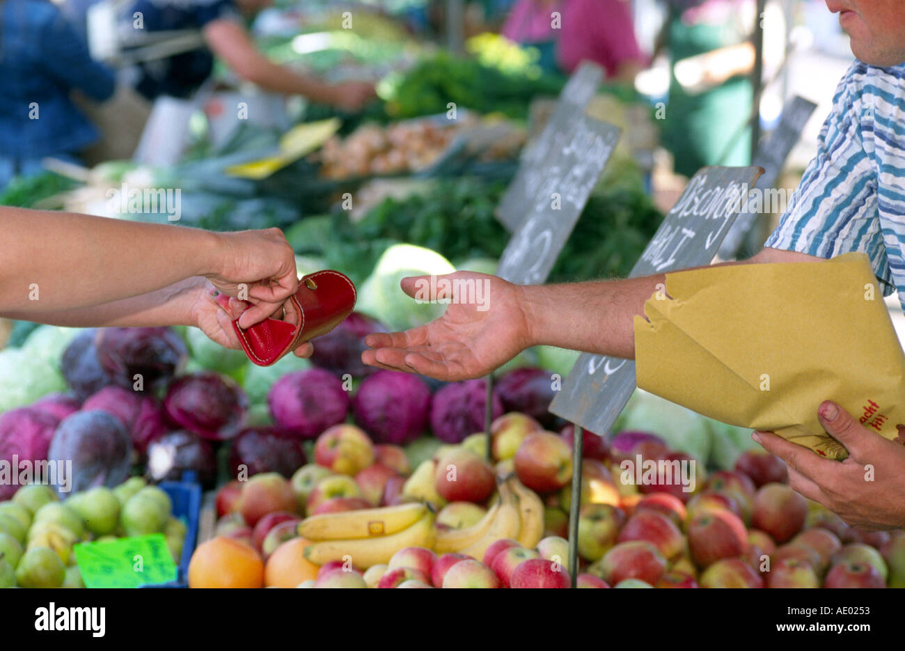 Paying handing money Stock Photo - Alamy
