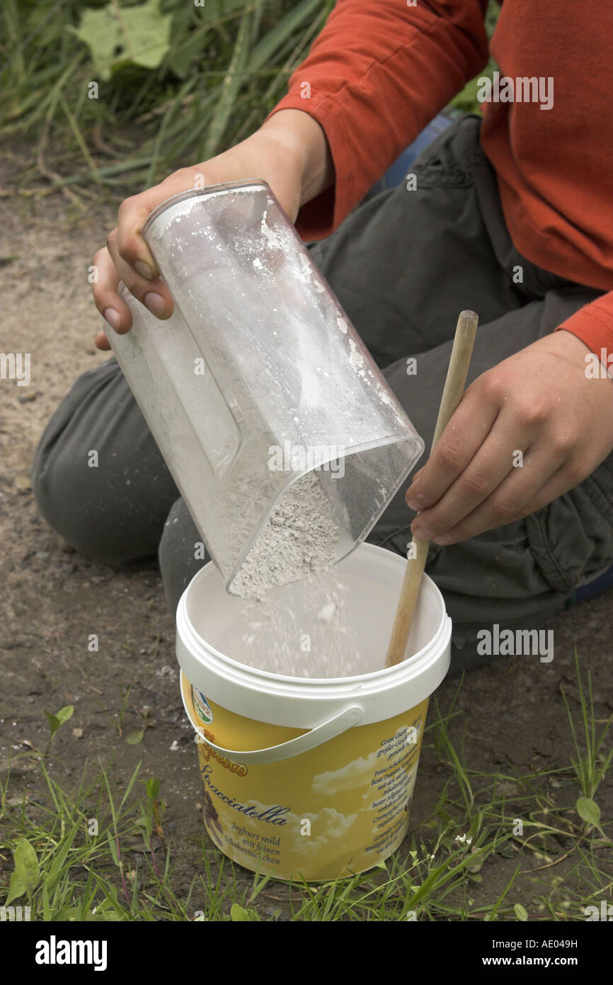 child making a cement copy of the trace of a roe deer Stock Photo - Alamy