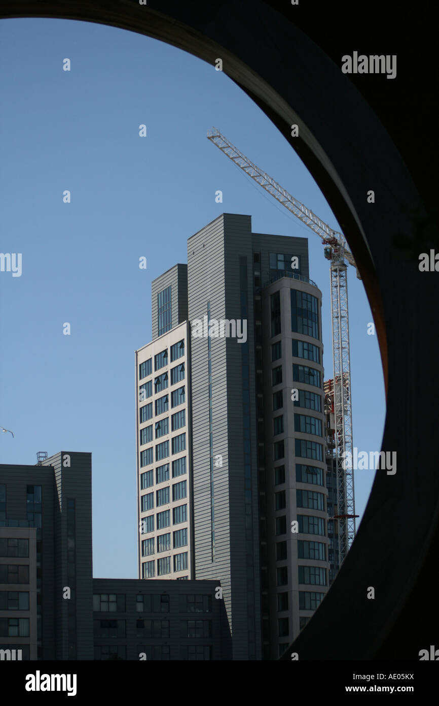 Liverpool pier Head, building and construction with red crane blue sky ...