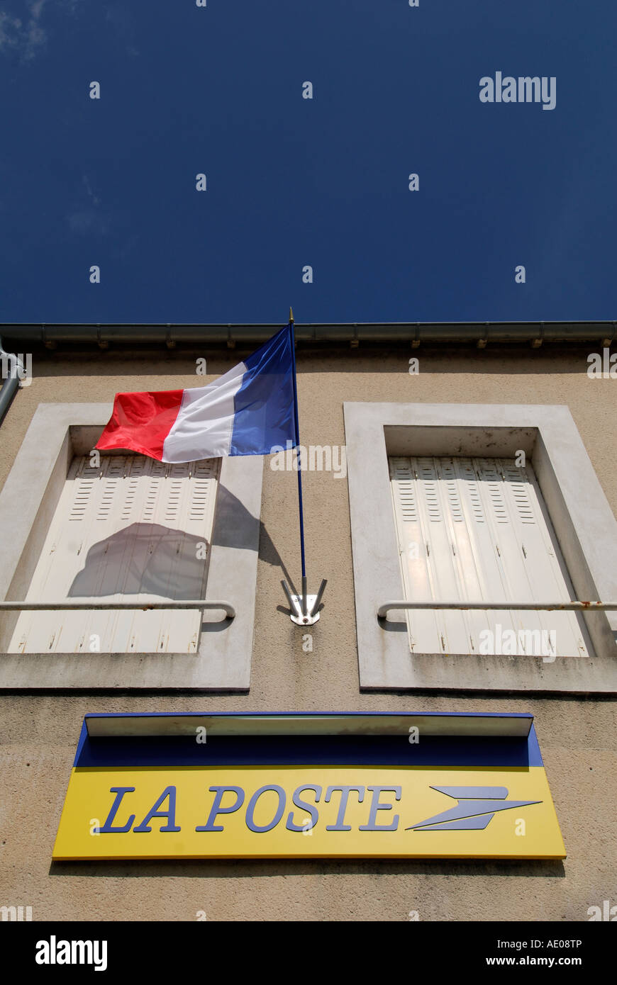 French tricolour flying outside La Poste (post office Stock Photo - Alamy