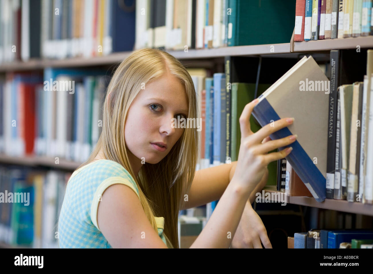 College Girl Studying in Library Stock Photo - Alamy