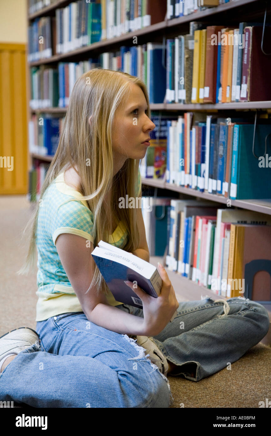 College Students Studying In Library