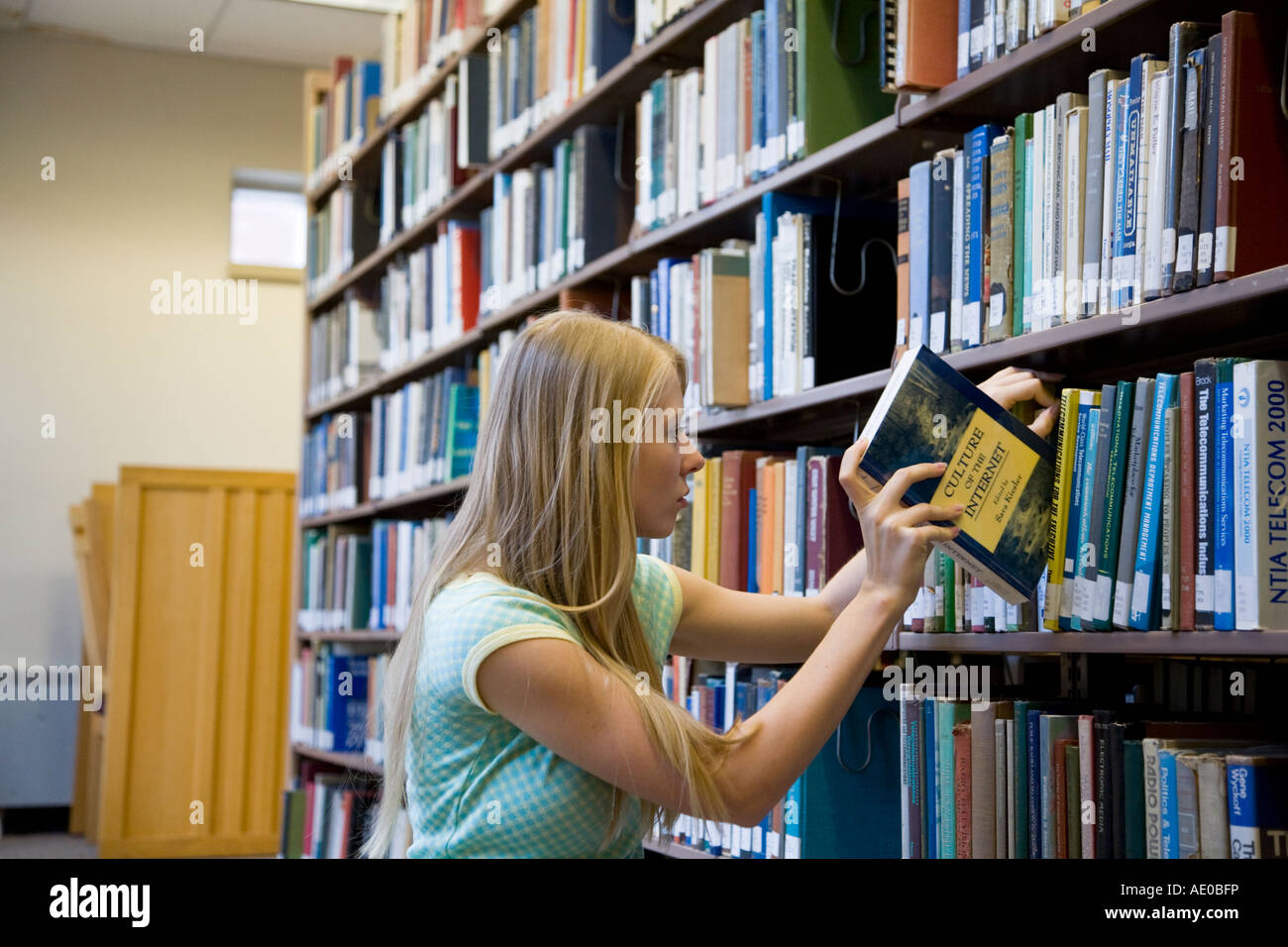 College Girl Studying in Library Stock Photo - Alamy