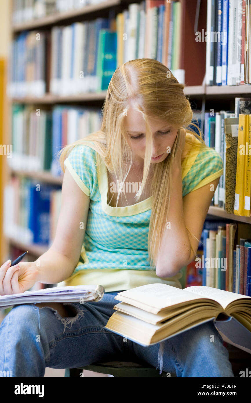 College Girl Studying in Library Stock Photo - Alamy