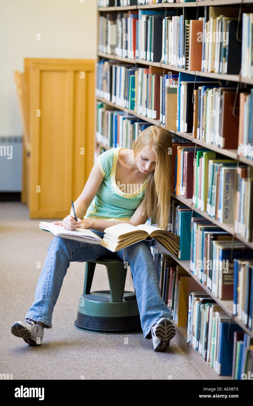 College Girl Studying in Library Stock Photo - Alamy