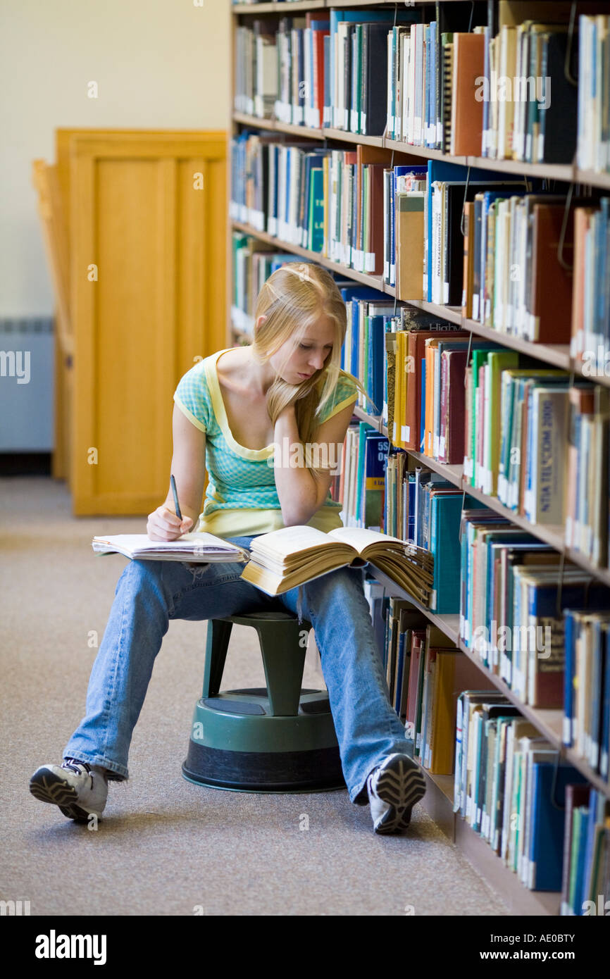 College Girl Studying in Library Stock Photo - Alamy