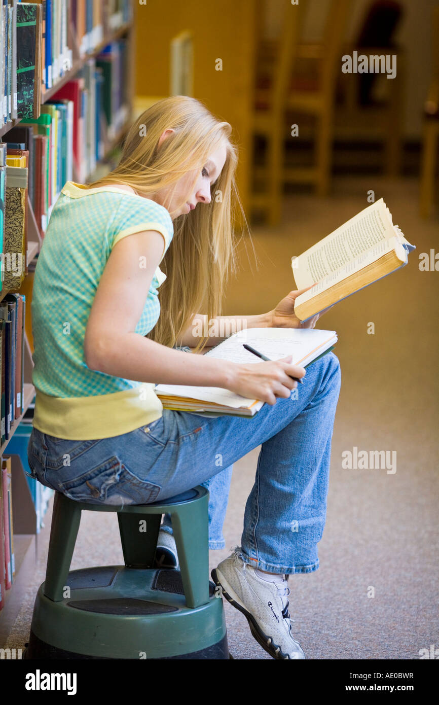 College Girl Studying in Library Stock Photo - Alamy