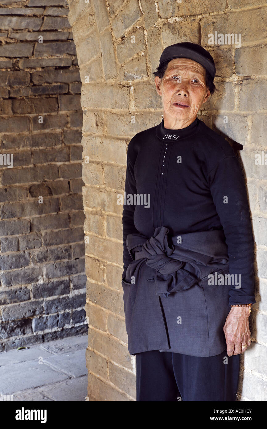 Woman standing in chamber inside a Great Wall watch tower Simatai Great ...