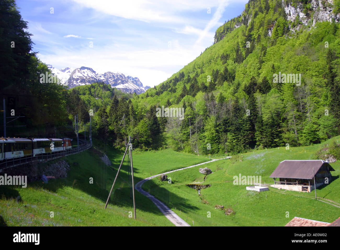 Alpine Village and railway Switzerland Stock Photo - Alamy
