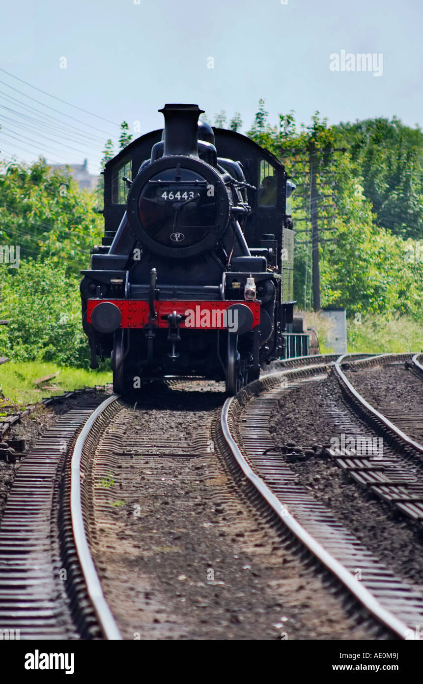 Steam Engine rolling down the track Stock Photo - Alamy