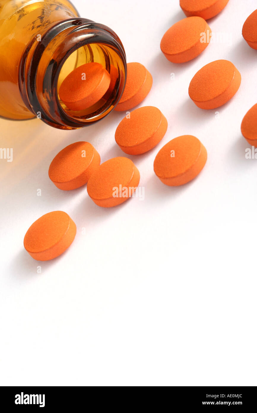 Bottle of Orange Pills Stock Photo - Alamy