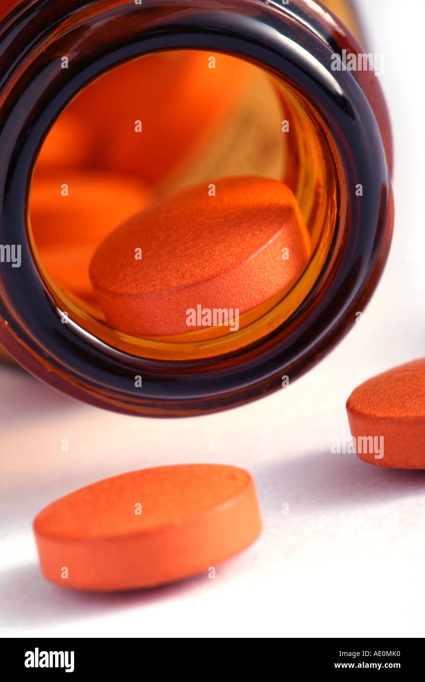 Bottle of Orange Pills Stock Photo - Alamy