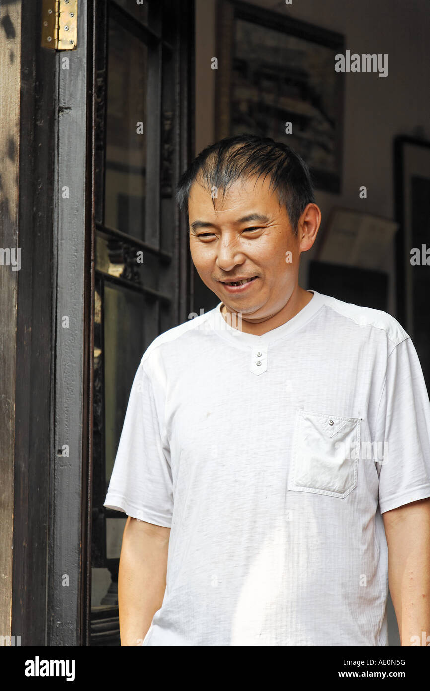 Chinese man in doorway Beijing China Asia Stock Photo - Alamy