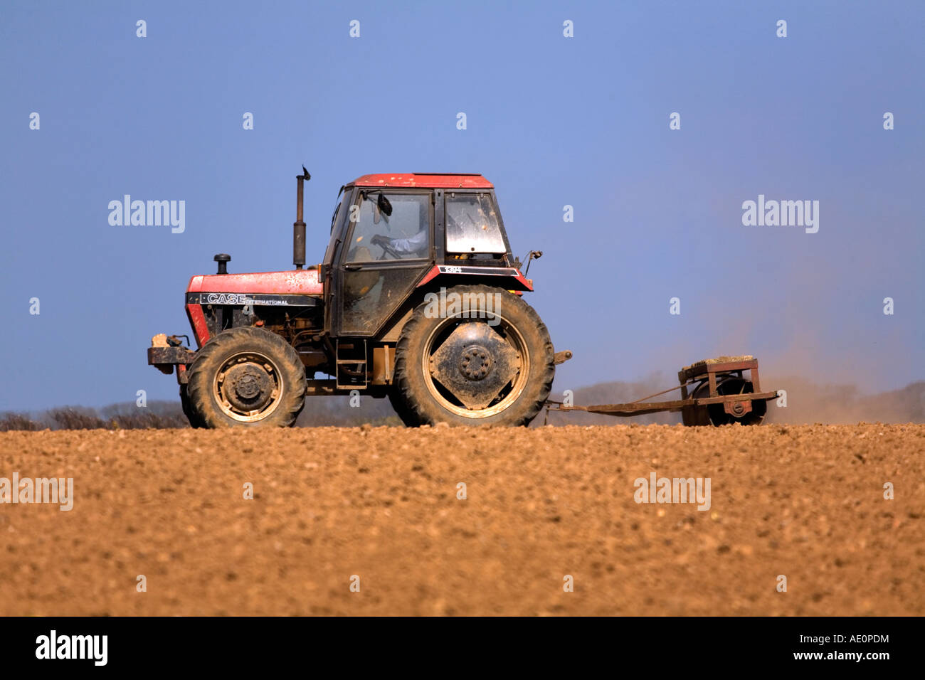 tractor rolling the land Cornwall Stock Photo - Alamy