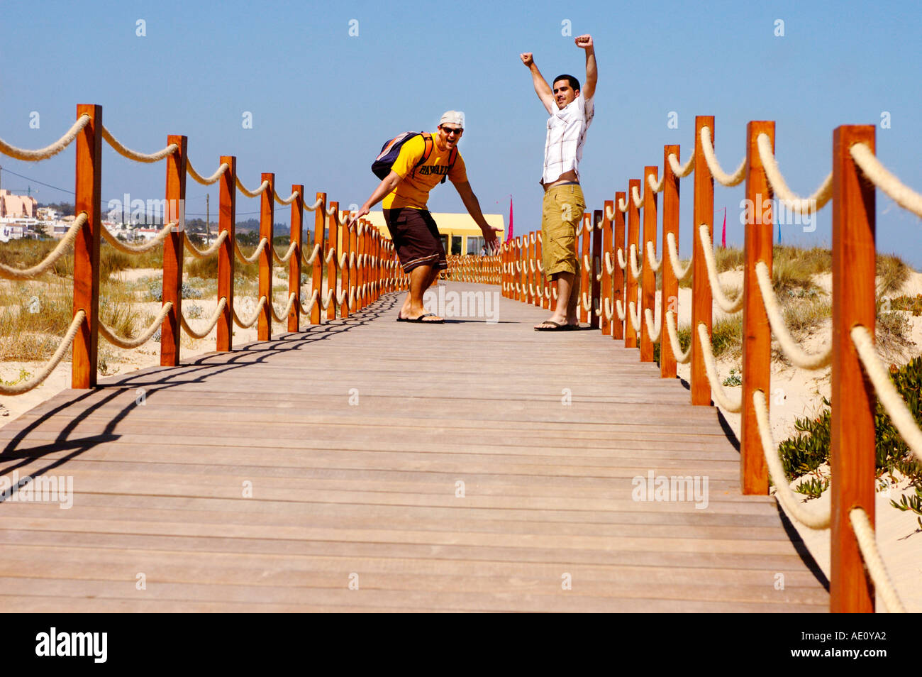 Portugal Lagos Men on boardwalk Stock Photo - Alamy