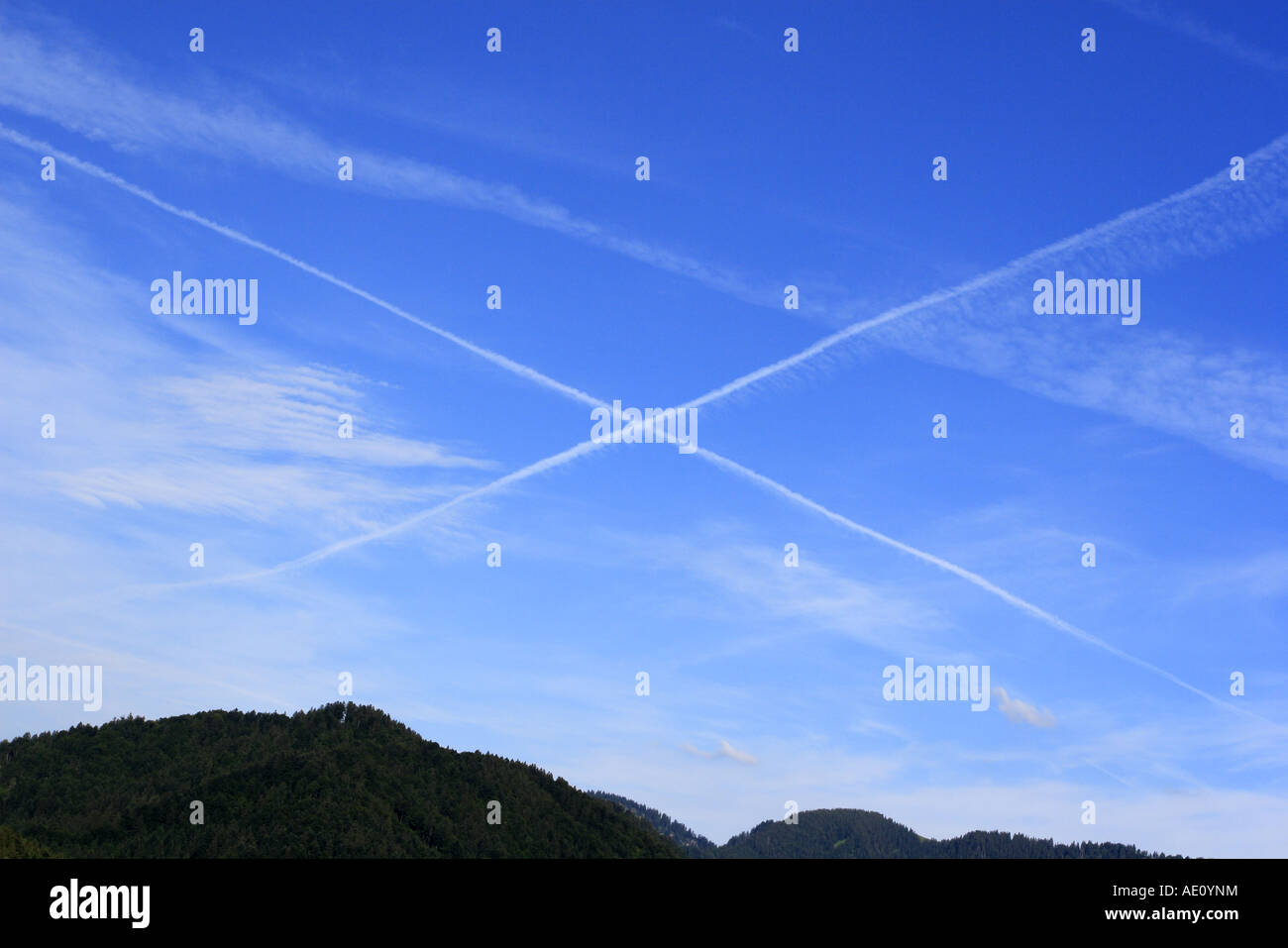 Jet trails over the Alps Bavaria form an X shape Stock Photo - Alamy
